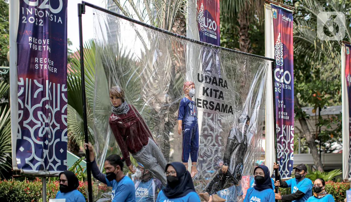 Aksi Simbolik Aktivis Lingkungan Menuntut Udara Bersih - Foto Liputan6.com