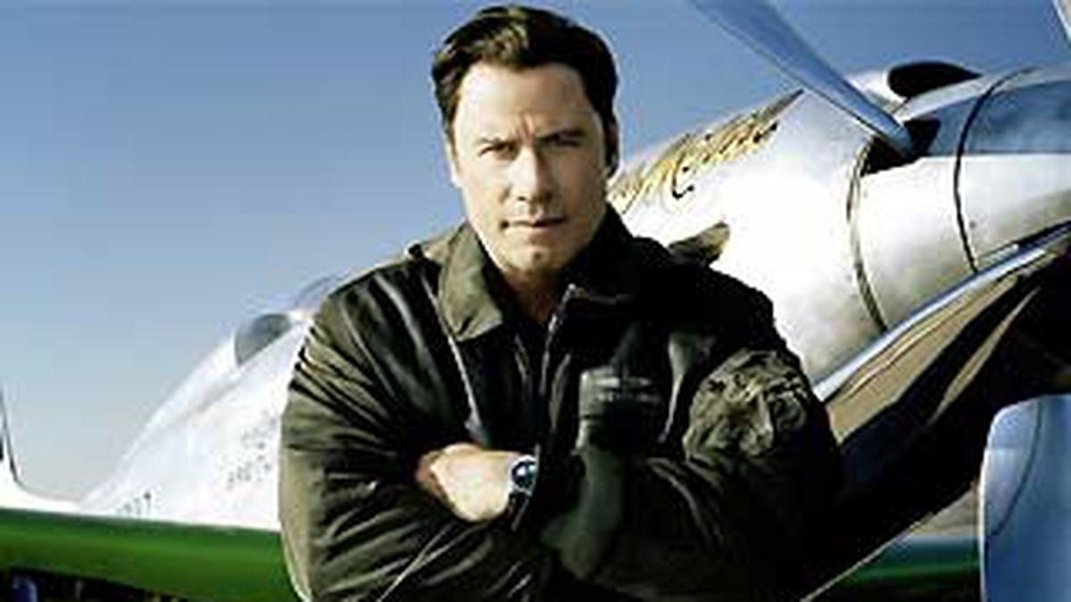 John Travolta Terbang ke Haiti