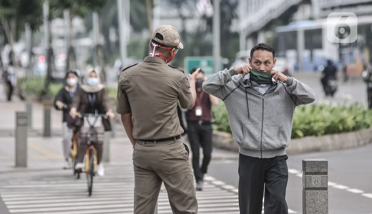 FOTO: Pembatasan 25 Persen Pekerja Kantoran di Jakarta - Foto Liputan6.com