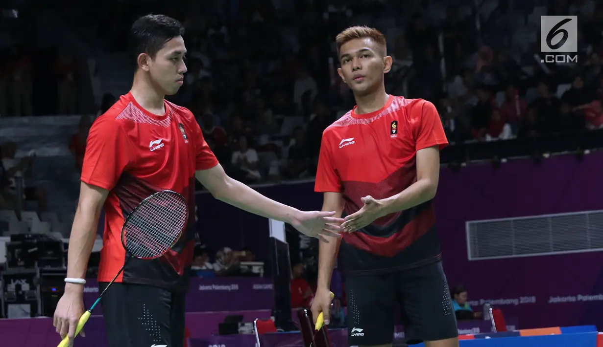 FOTO: Fajar dan Rian Muluskan Langkah Bulutangkis Beregu Putra ke ...