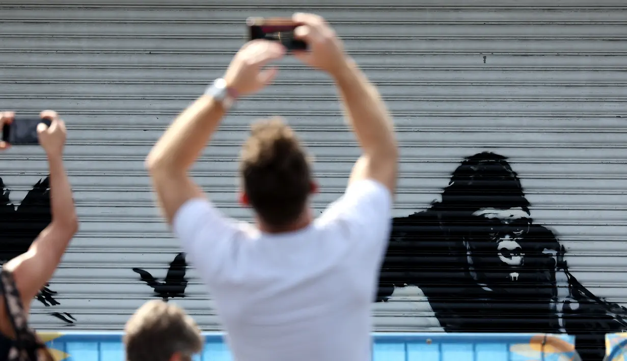 Mural Baru Banksy Muncul di Kebun Binatang London - Foto Liputan6.com