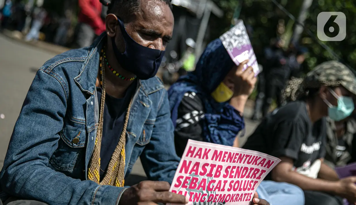 FOTO: Aliansi Mahasiswa Papua Gelar Aksi di Kawasan Patung Kuda - Foto ...