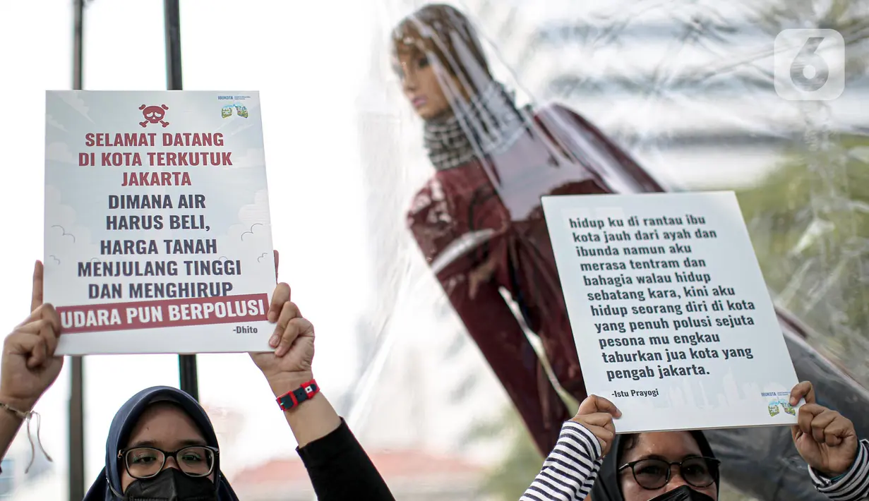 Aksi Simbolik Aktivis Lingkungan Menuntut Udara Bersih - Foto Liputan6.com