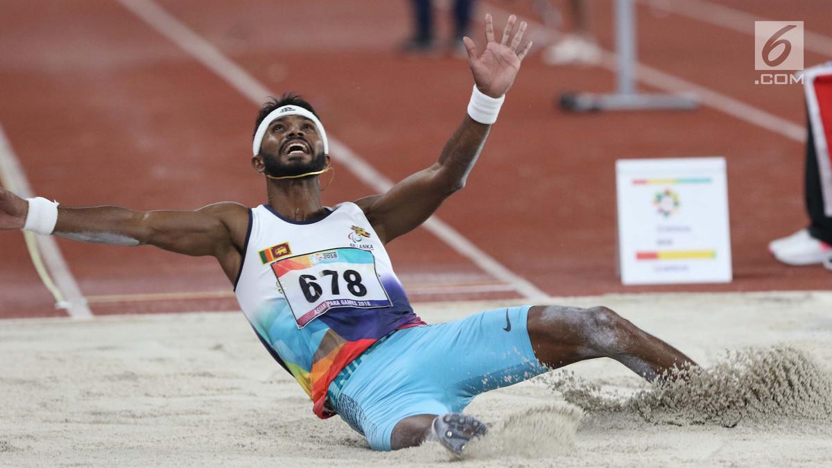 FOTO: Ekspresi Atlet Para Lompat Jauh Saat Mendarat - Foto Liputan6.com