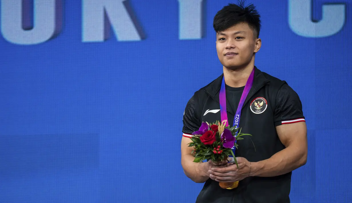 Foto: Aksi Rahmat Erwin Abdullah saat Pecahkan Rekor Dunia Angkat Besi dan Raih Medali Emas ...
