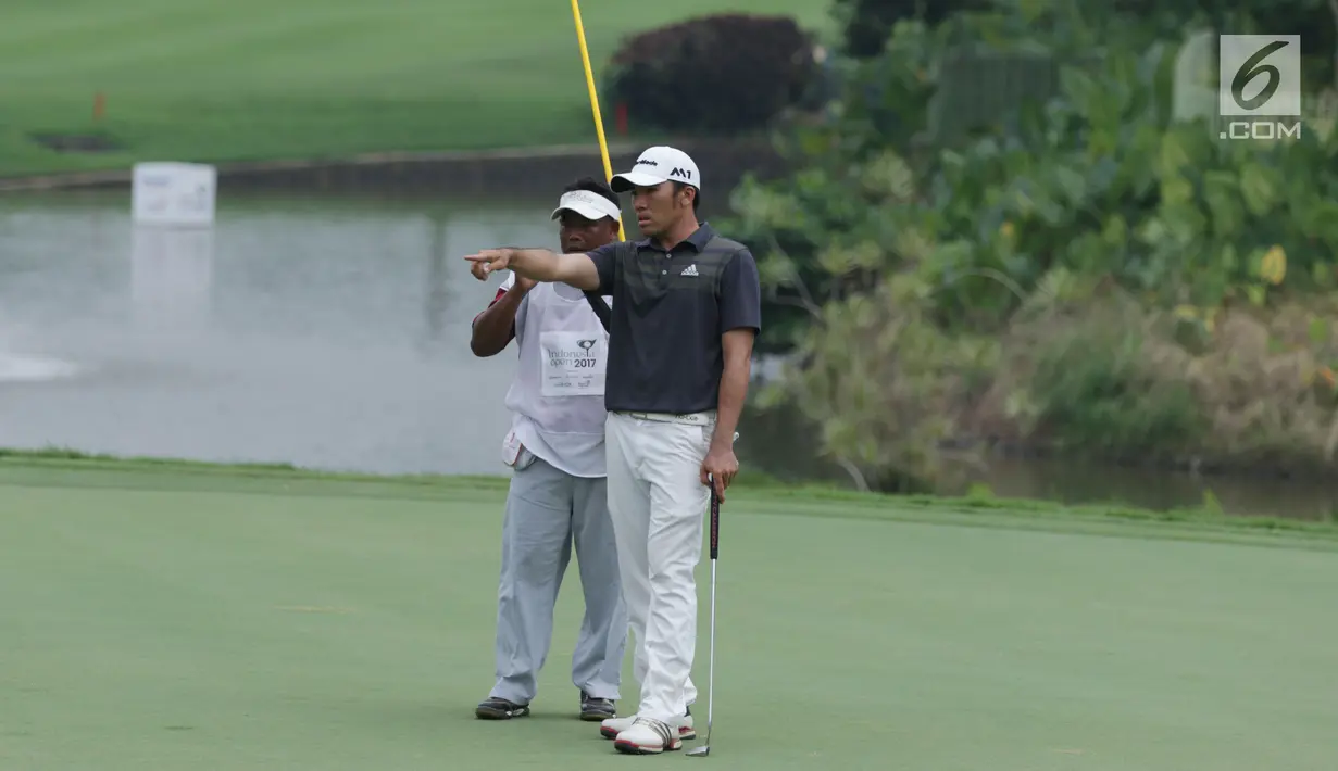 PHOTO: Aksi Danny Masrin dan Rory Hie di Golf Indonesia Open 2017 - Foto Liputan6.com